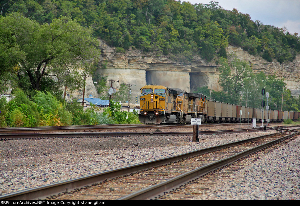 UP 6729 heads a EB past the rock cliffs.
